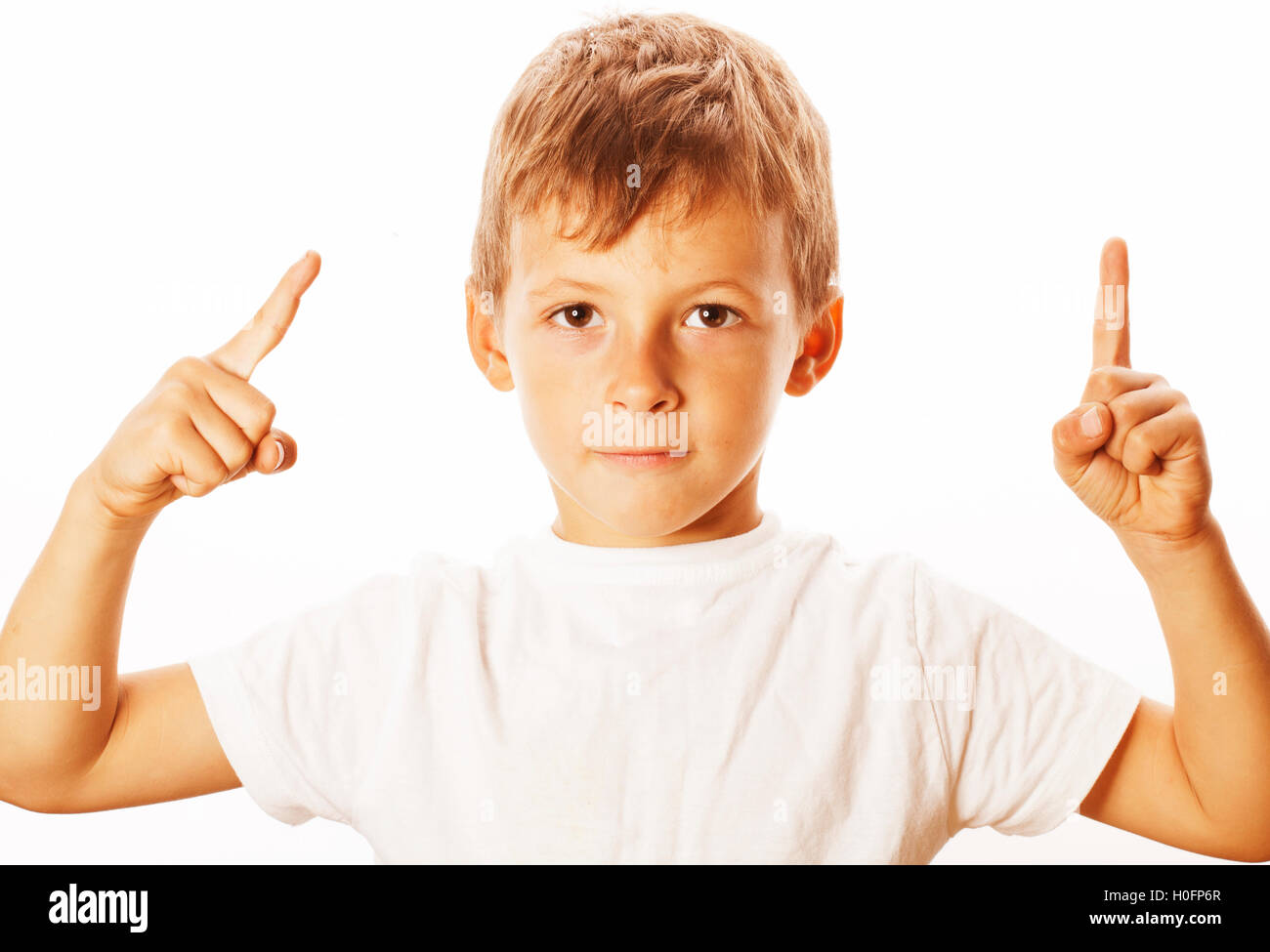 little cute white boy pointing in studio isolated close up Stock Photo ...