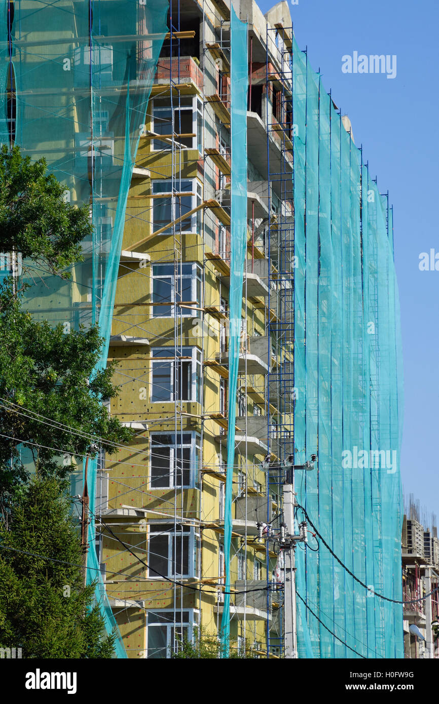 Safety net in the newly built high-rise building. Green grid on ...