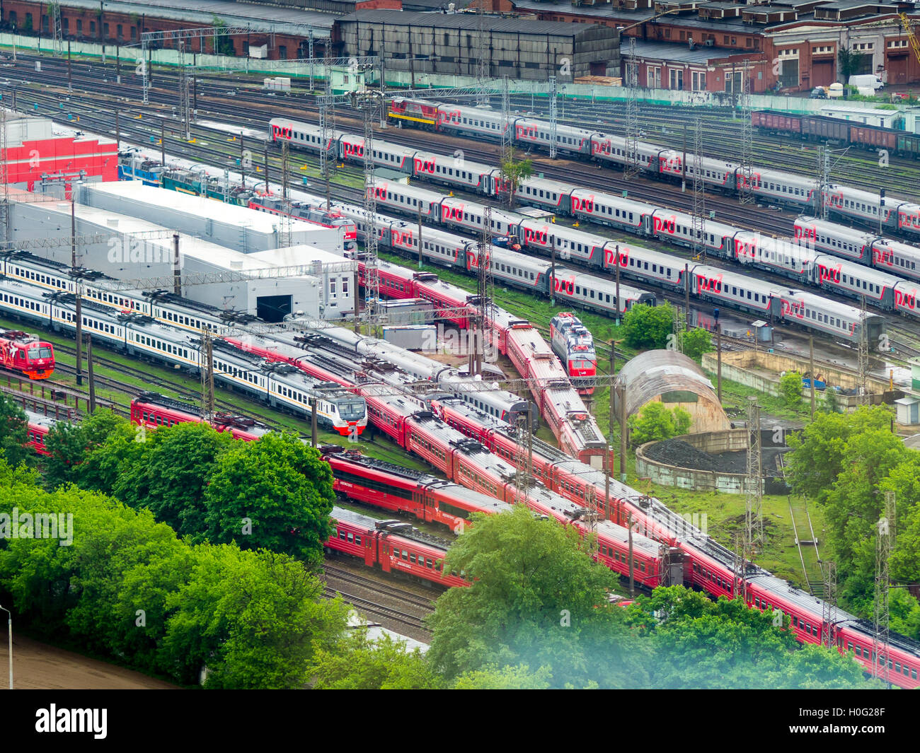 Lots of colorful passenger trains near a station in Russia Stock Photo ...