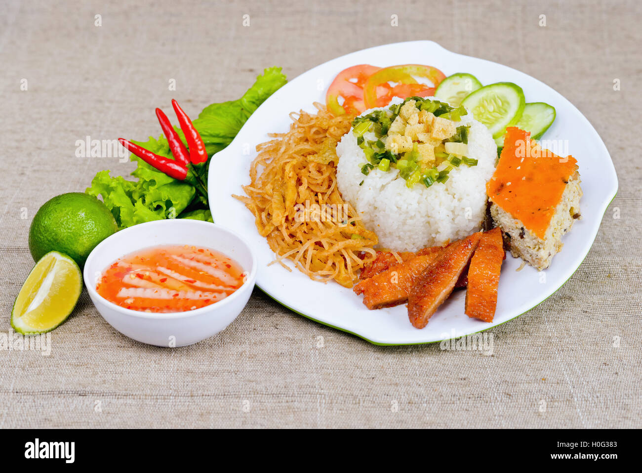 Special broken rice with fish sauce, lemon, fried pig skin, sliced ...