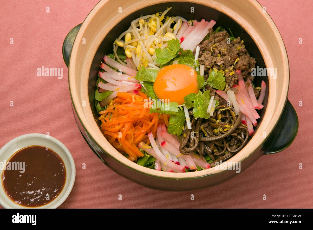 Special salad with sliced radish, carrot, minced beef and red egg with ...