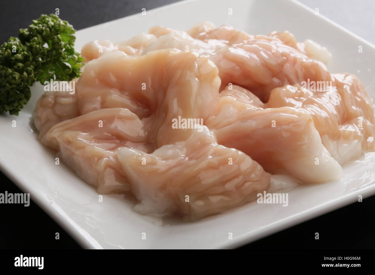 Fresh raw Wagyu beef stomach on the hormone white platter Stock Photo ...