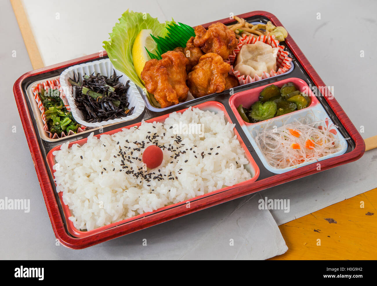 Faint fried chicken lunch with fried tempura, chili and plain rice in ...