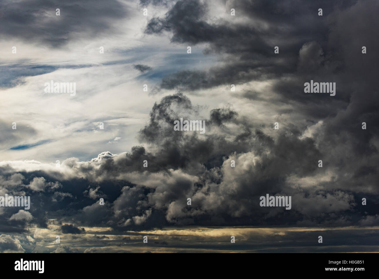 Blue sky with different types of dramatic cloud formations Stock Photo ...