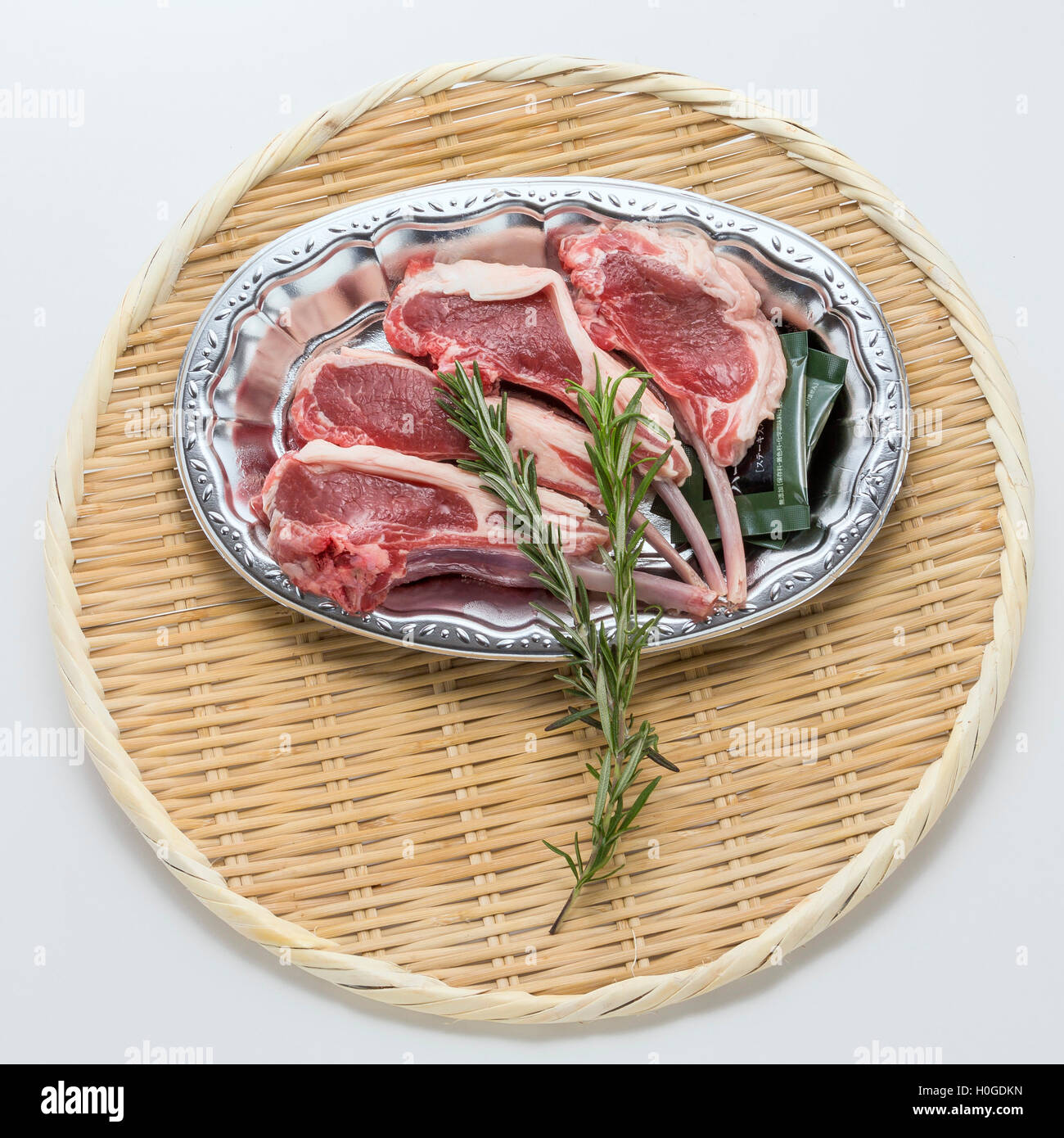 Fresh red beef cow ribs with rosemarry on bamboo tray Stock Photo - Alamy