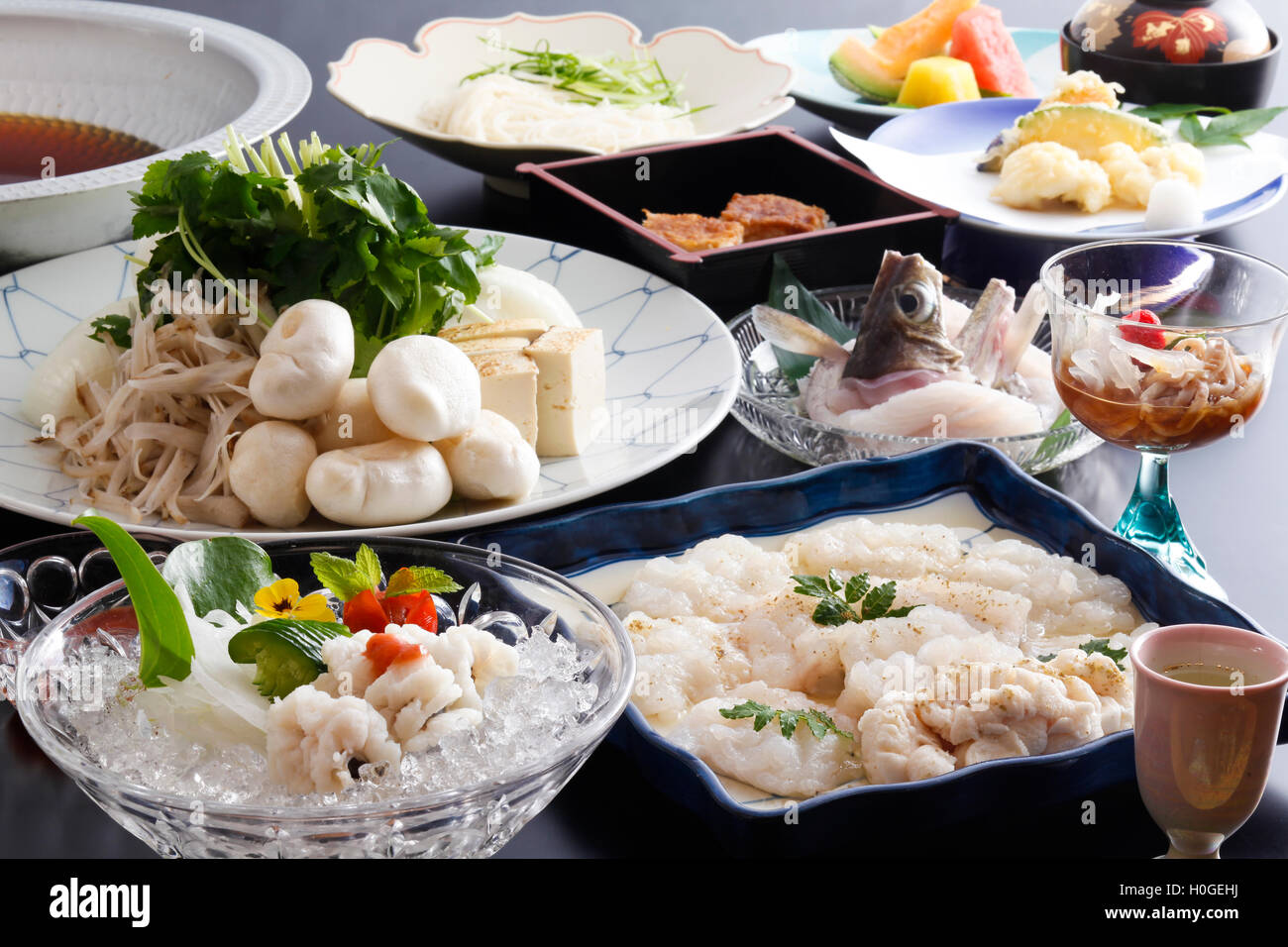 Table meal with fesh fish, meat ball, vegetables, seafood and tofu on ...