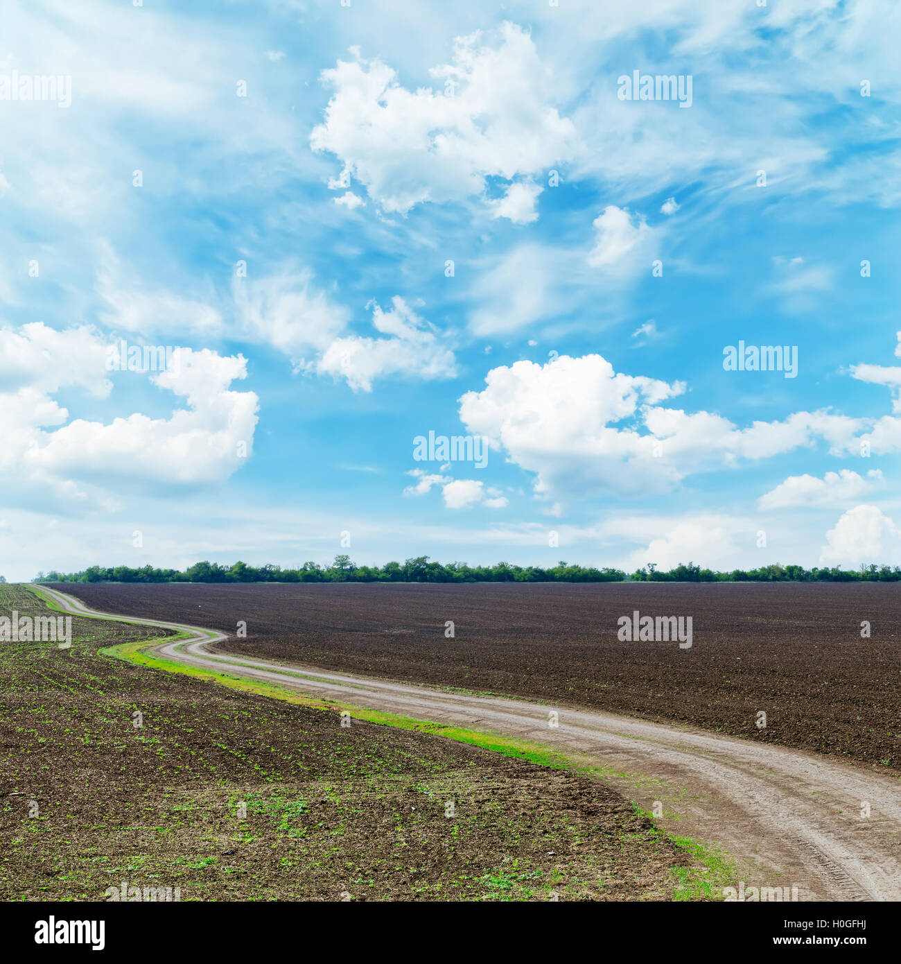 winding rural road under dramatic sky Stock Photo - Alamy