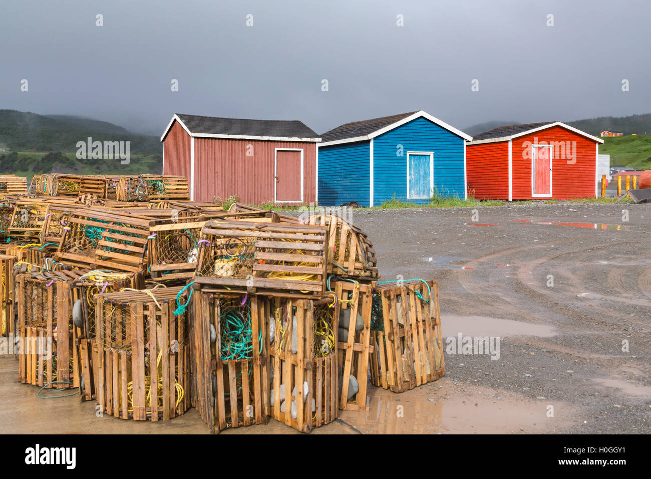 Colorful fishing stages and lobster traps in Trout river, Newfoundland ...
