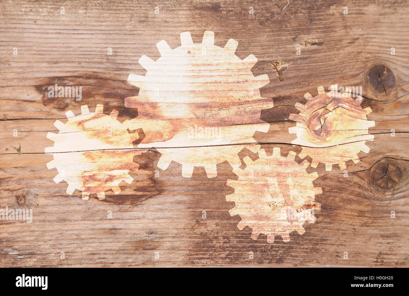 Illustration of gears at brown wooden background Stock Photo - Alamy