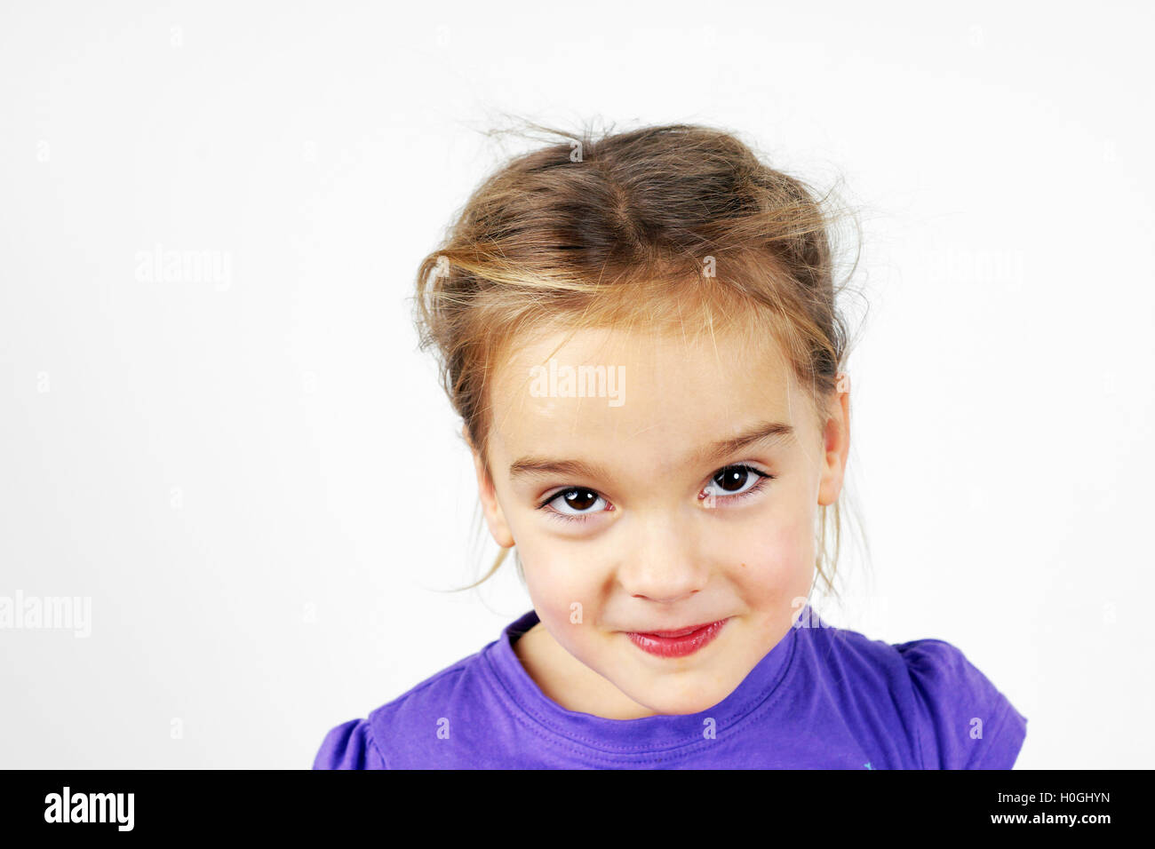 Mischievous little blond girl Stock Photo - Alamy
