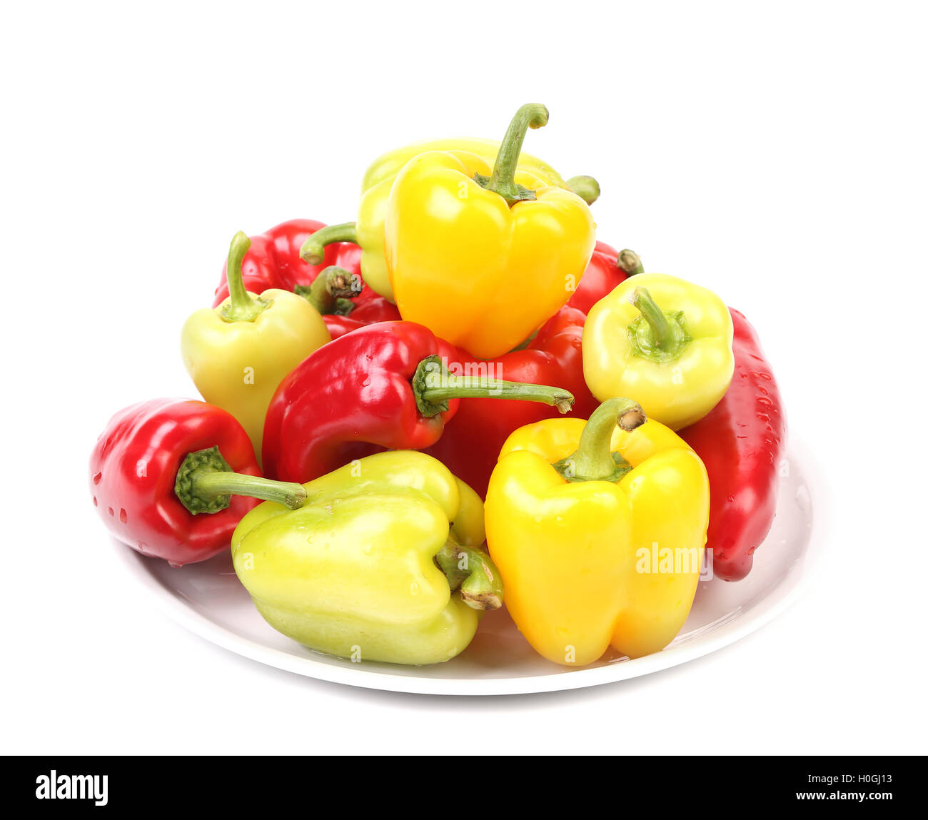 Collection of colored paprika in a white plate Stock Photo - Alamy