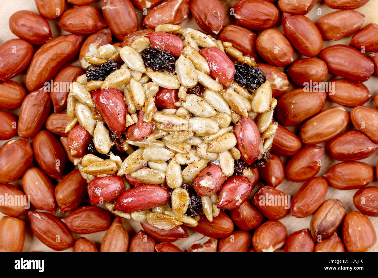 Round candied seeds and nuts with peanuts Stock Photo - Alamy