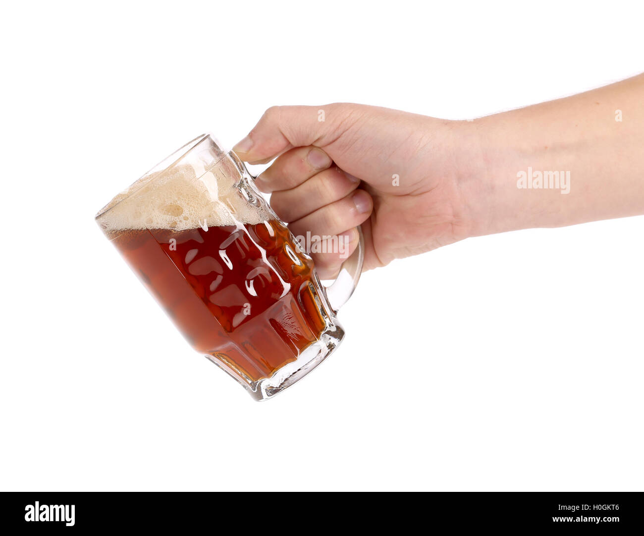 Glass of beer in hand Stock Photo - Alamy