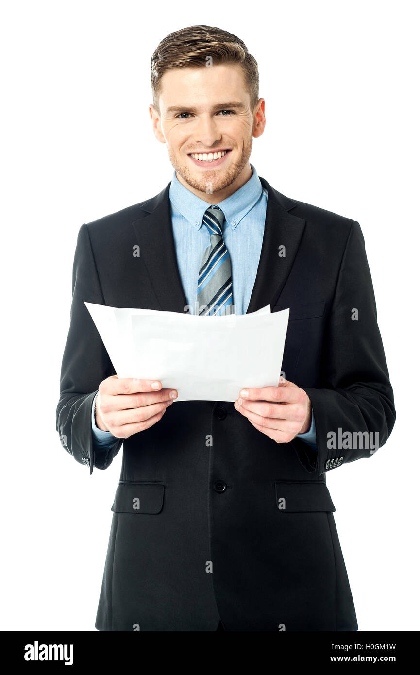 Businessman holding important deal documents Stock Photo - Alamy