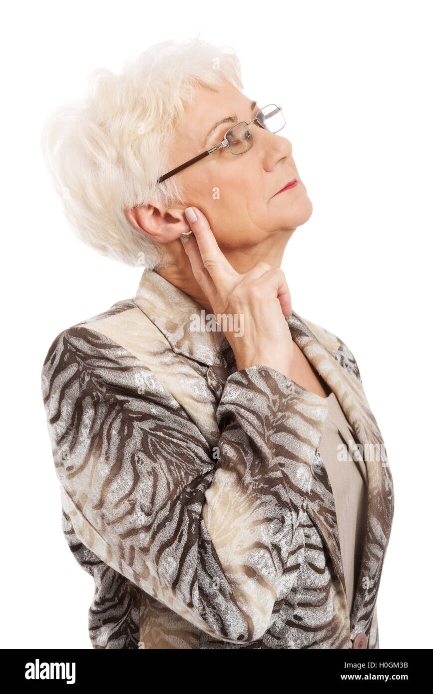 An old elegant lady touching her temple Stock Photo - Alamy