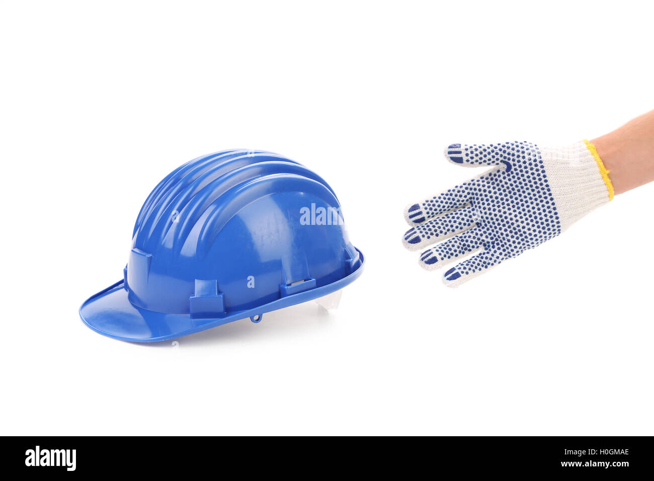 Hand holding blue hard hat Stock Photo - Alamy