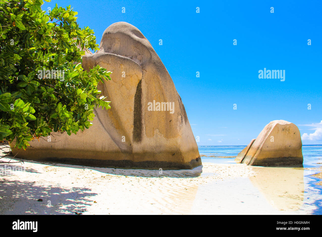 Exotic lagoon between large smooth rocks in the Seychelles Stock Photo ...