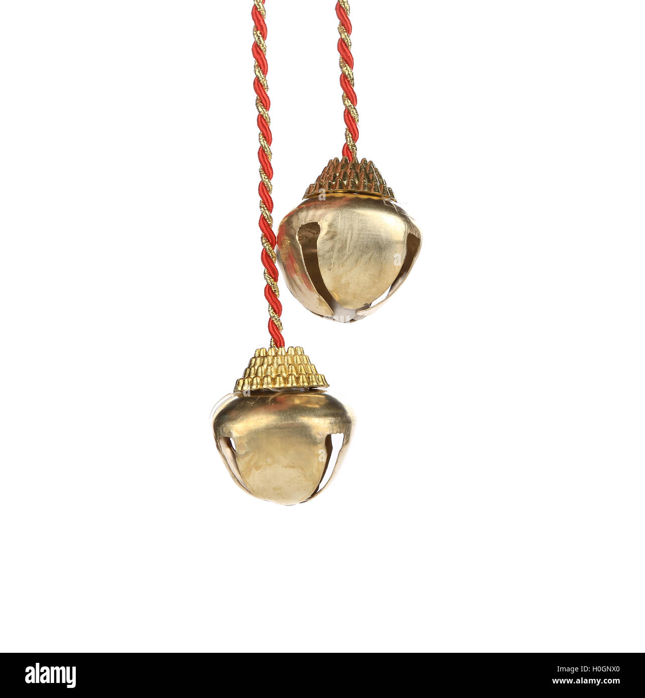 Golden jingle bells on a rope Stock Photo - Alamy