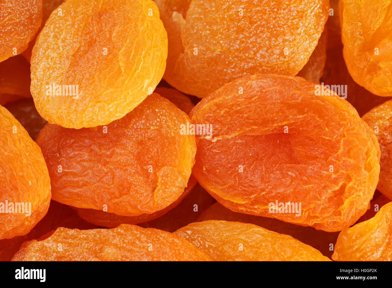 Dried apricot background Stock Photo - Alamy