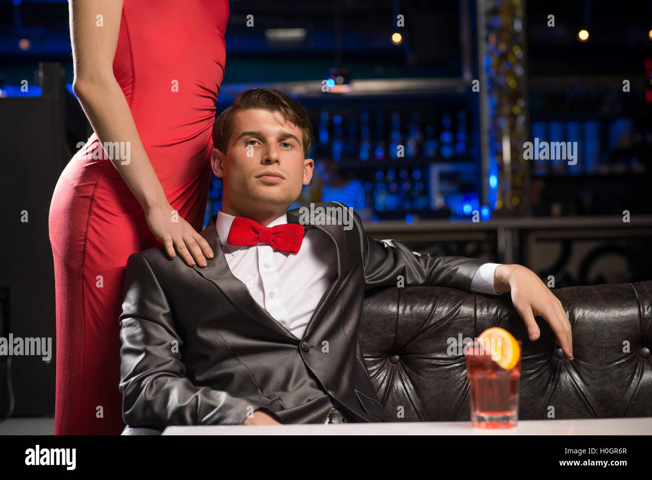 Portrait of a successful man in a nightclub Stock Photo - Alamy
