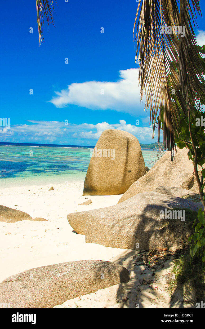 Large smooth stones with turquoise water on the paradise island of ...