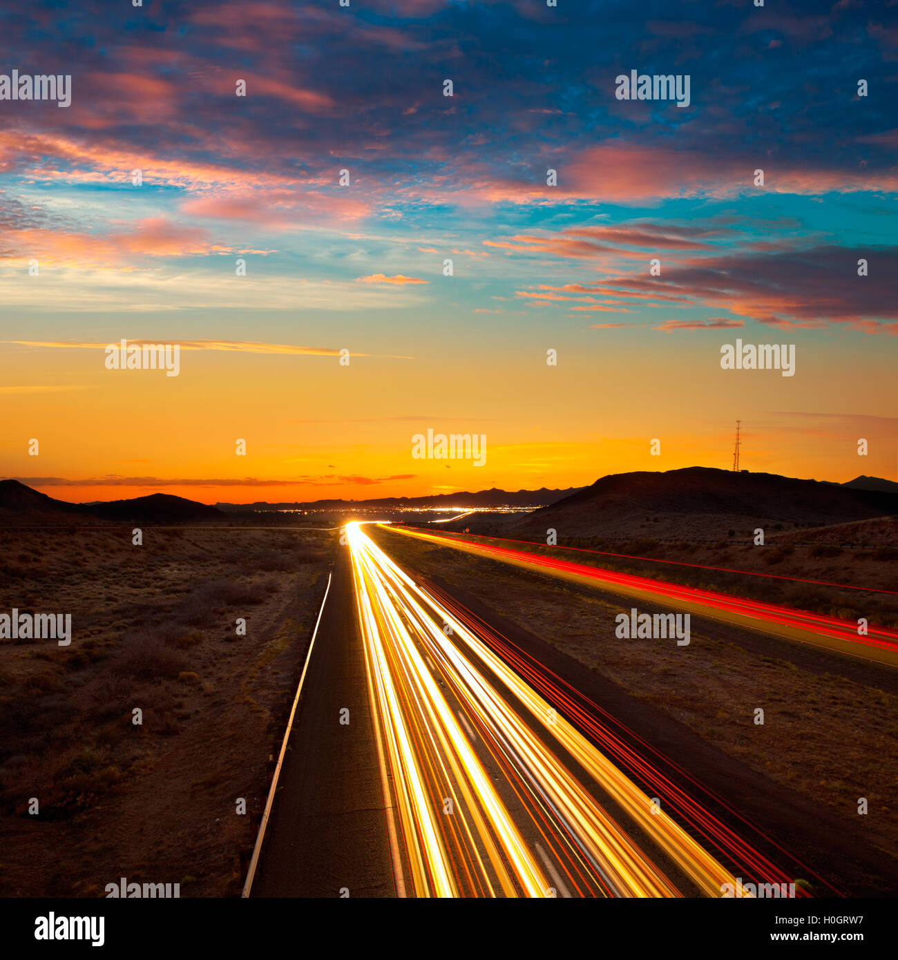 Arizona sunset at Freeway 40 with cars light traces Stock Photo - Alamy