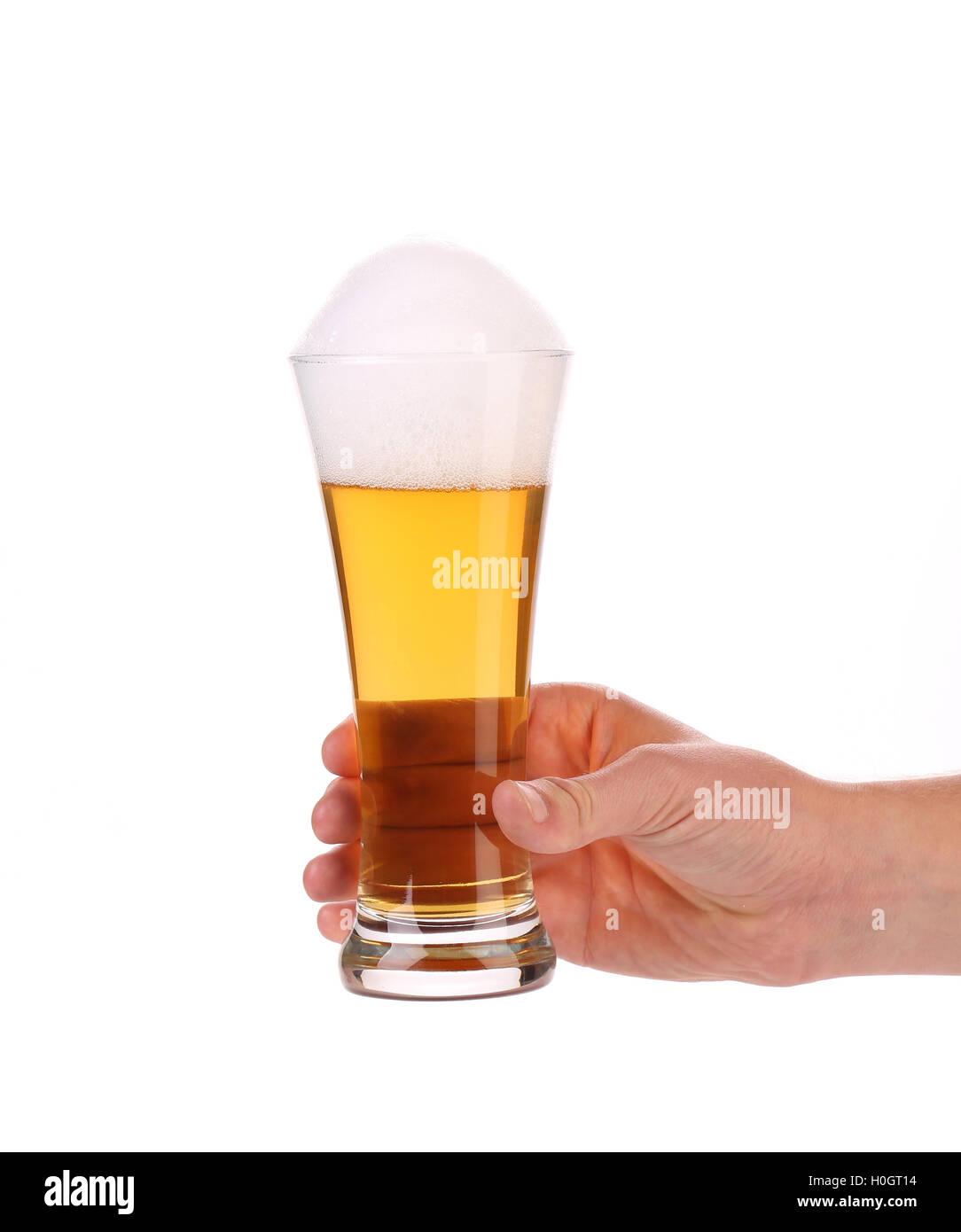 Glass of beer in hand Stock Photo - Alamy