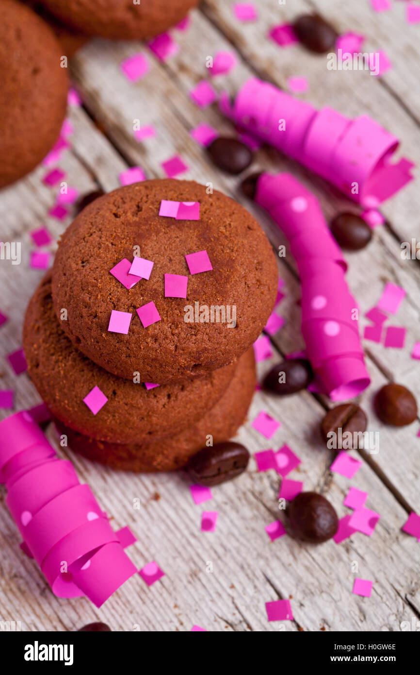 fresh chocolate cookies, coffee beans, pink ribbons and confetti Stock ...
