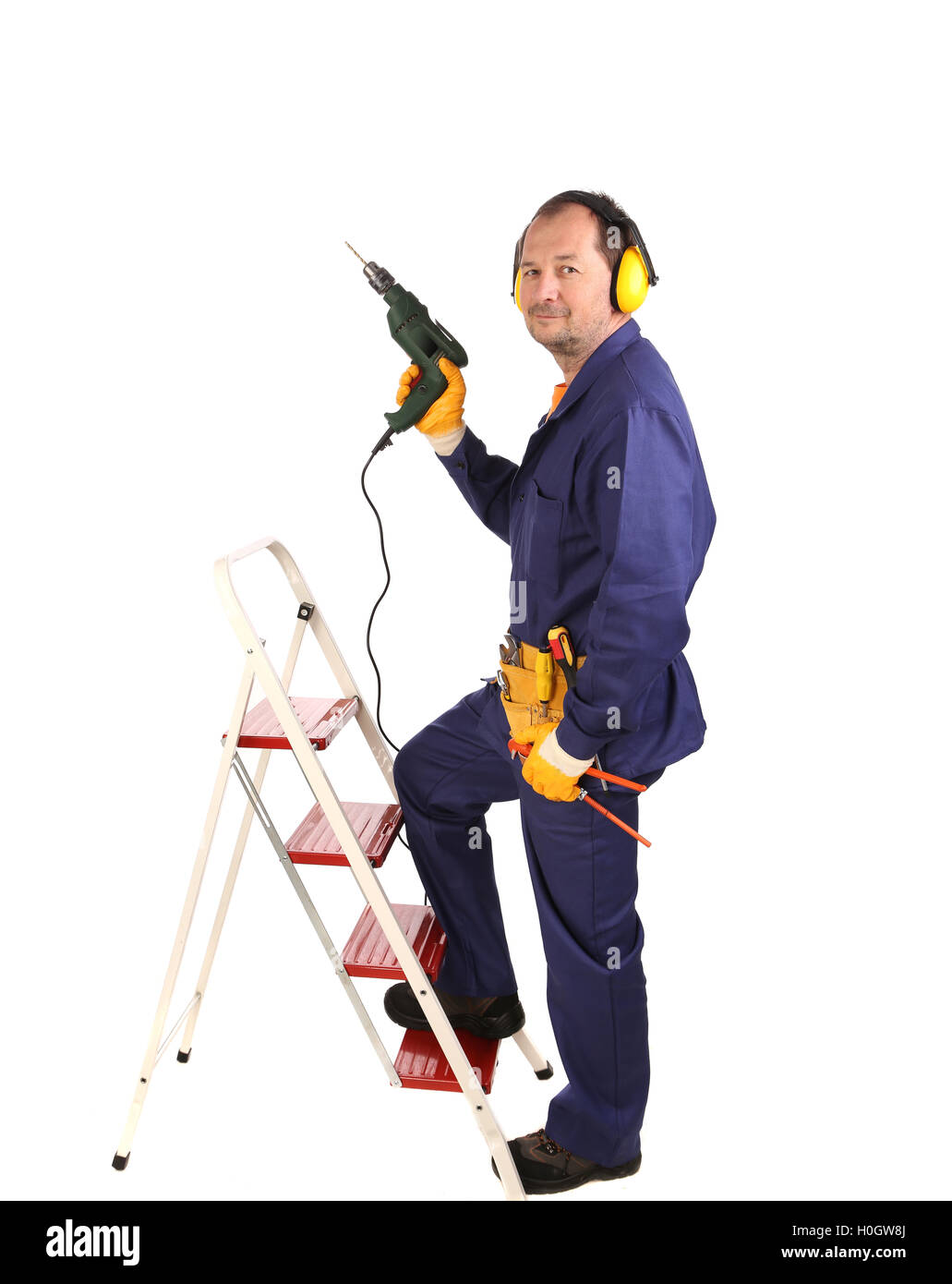 Worker on ladder with drill Stock Photo - Alamy