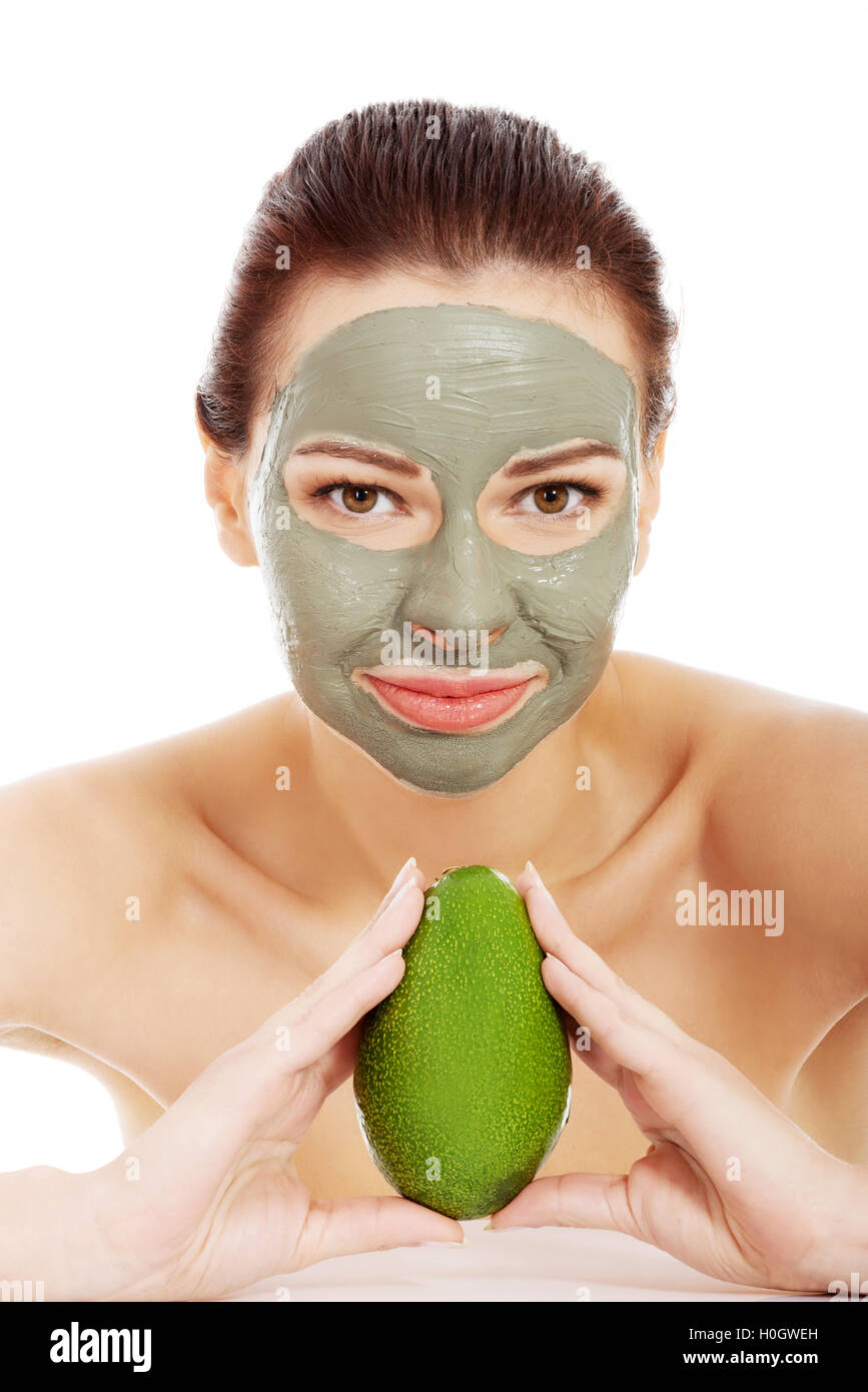 Beautiful woman with facial mask holding avocado Stock Photo - Alamy