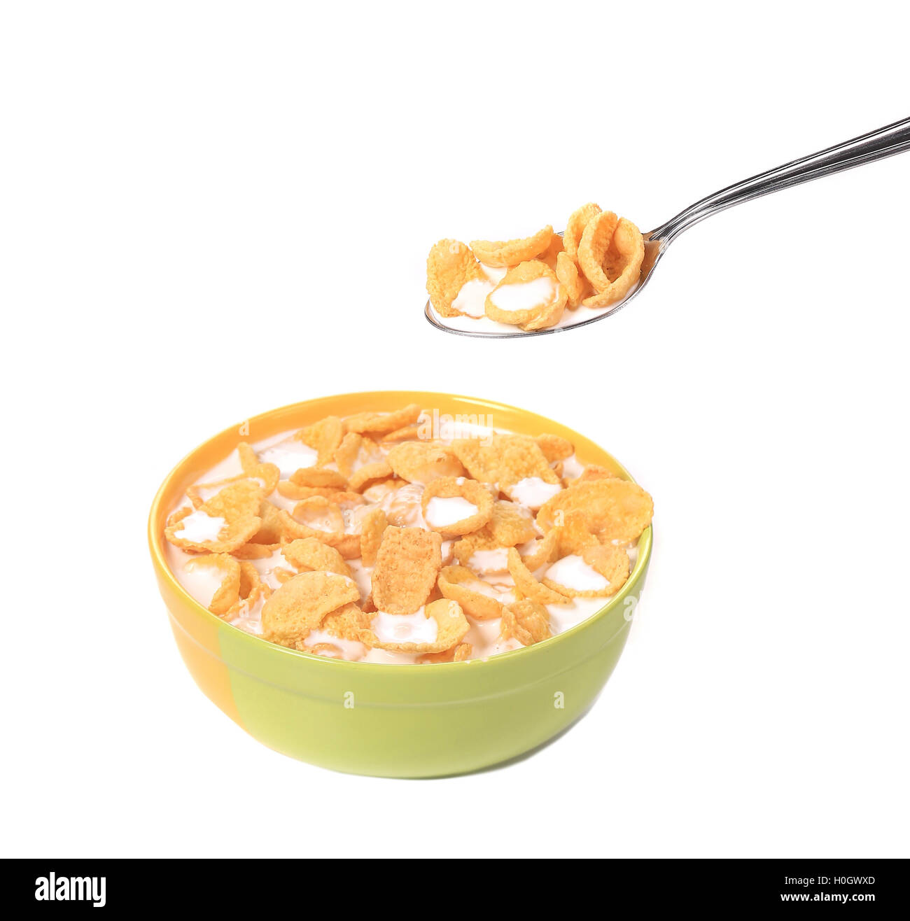 Bowl of sugar-coated corn flakes and spoon Stock Photo - Alamy
