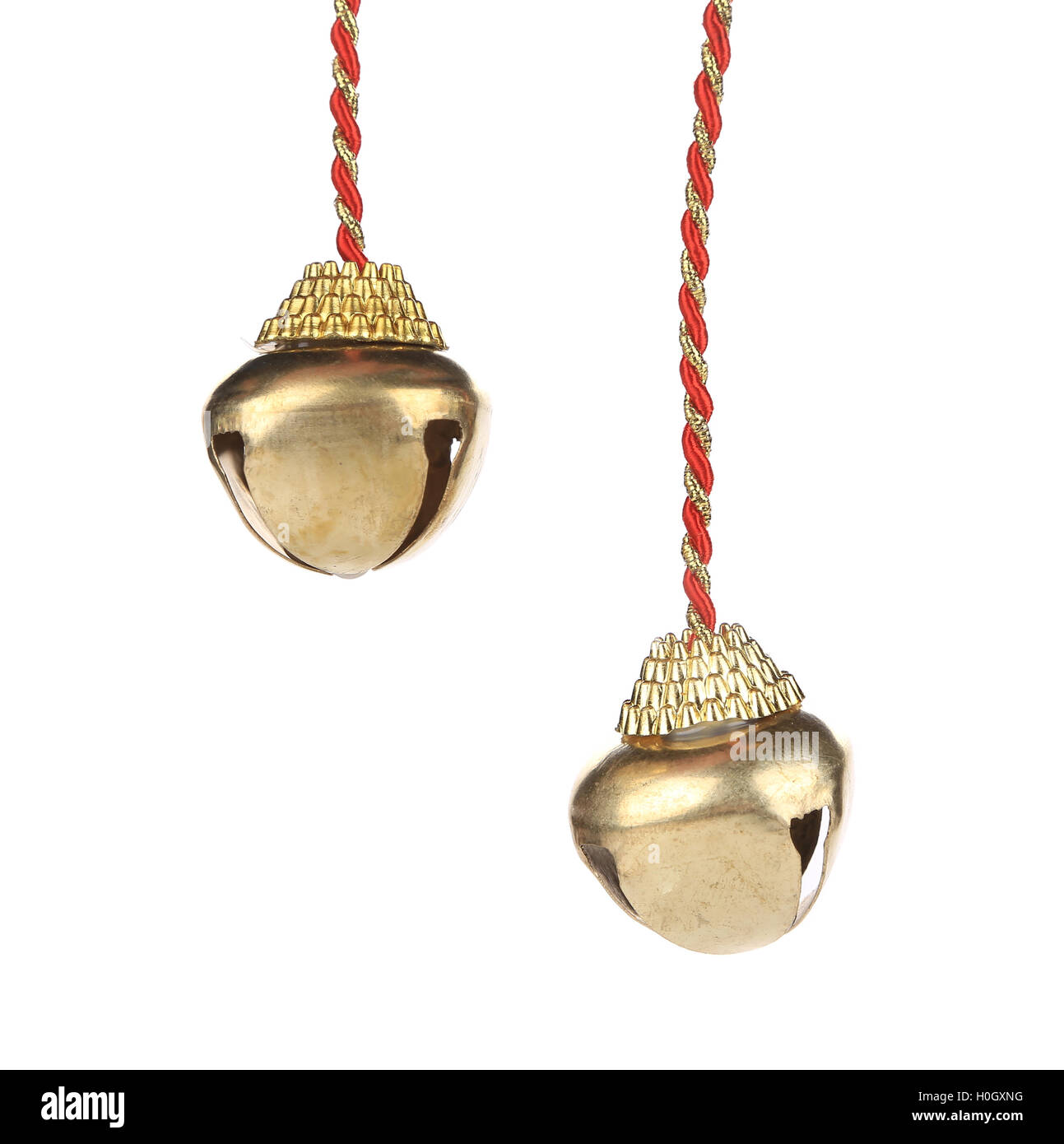 Golden jingle bells on a rope Stock Photo - Alamy