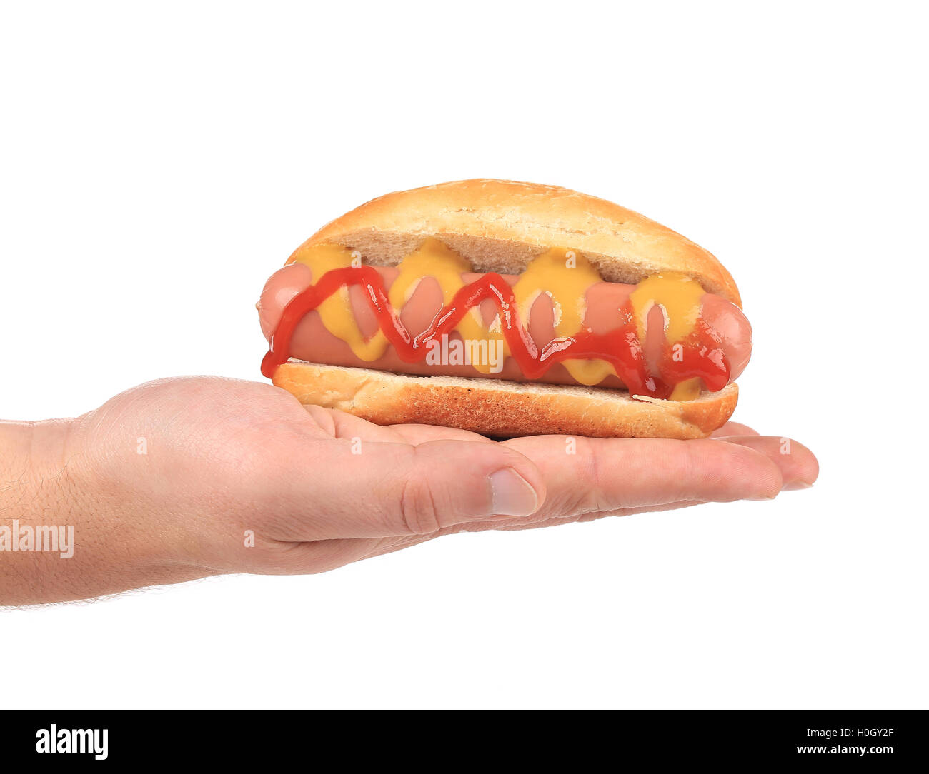 Hand holding hotdog Stock Photo - Alamy