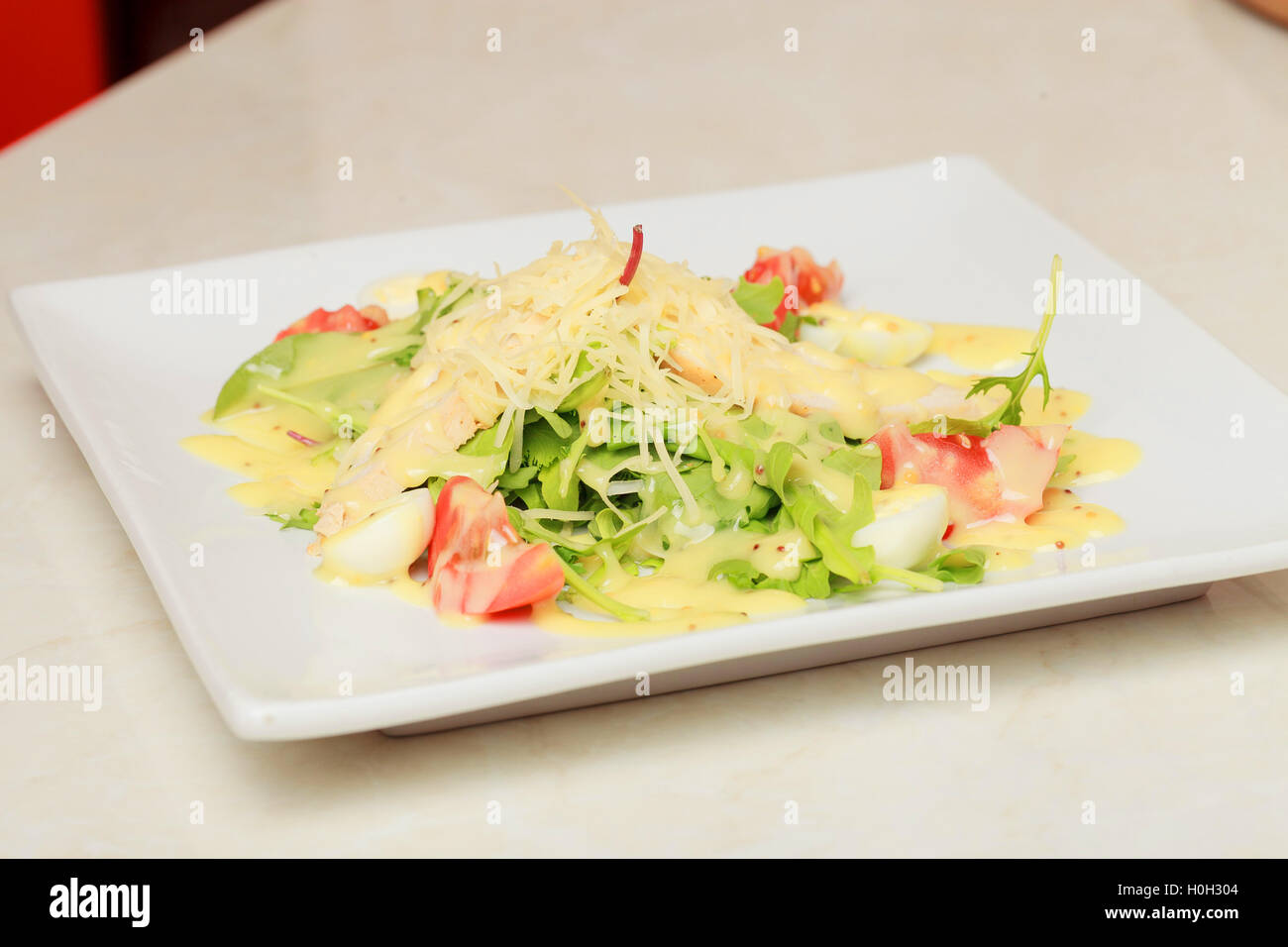 salad with eggs, tomatoes, chicken and cheese Stock Photo - Alamy