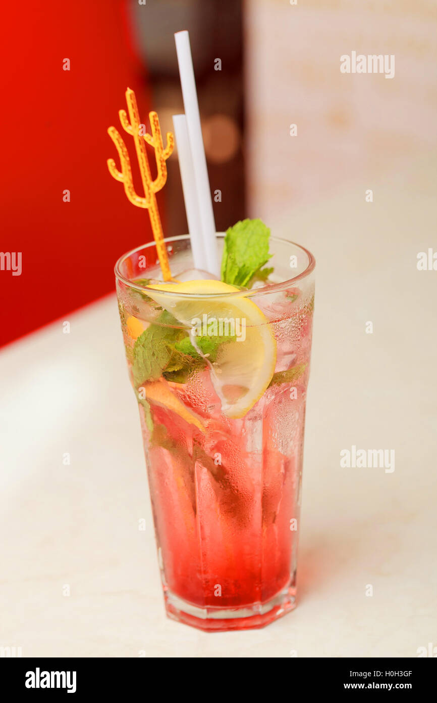 Cold cocktail with mint, lemon, tonic, vodka and ice Stock Photo - Alamy