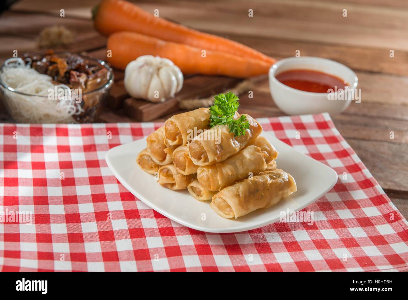 Plate of spring rolls on the table in restaurant Stock Photo - Alamy