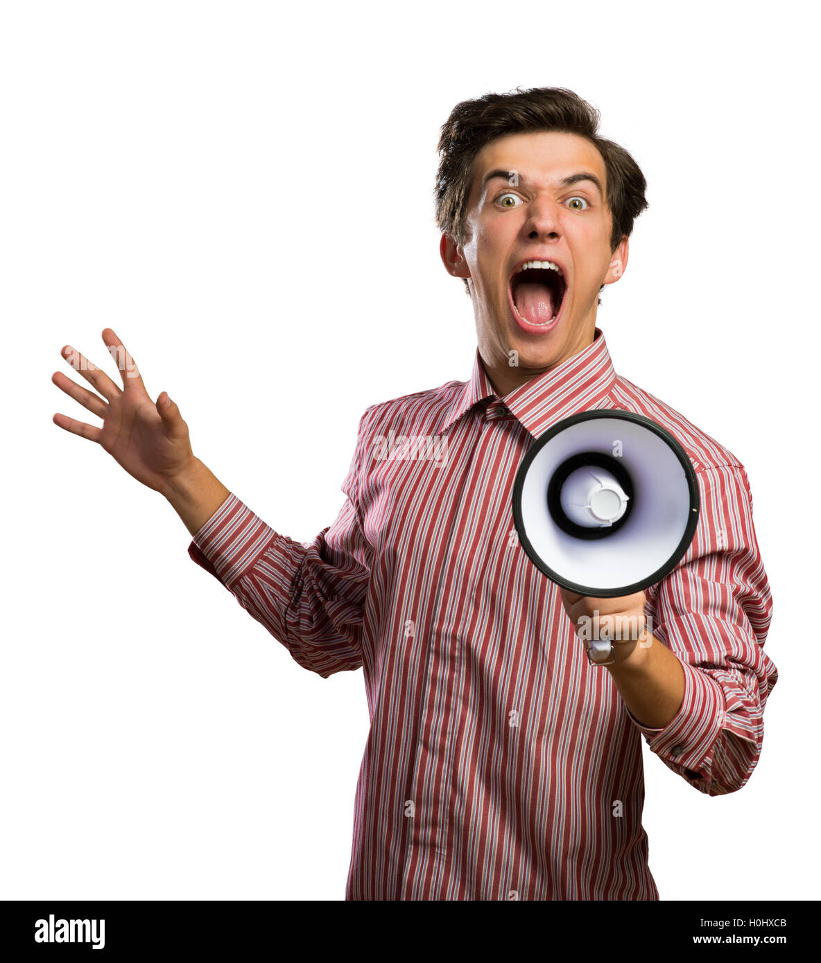Portrait of a young man shouting using megaphone Stock Photo - Alamy
