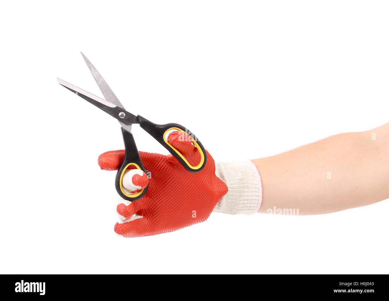 Scissors in hand with gloves Stock Photo - Alamy