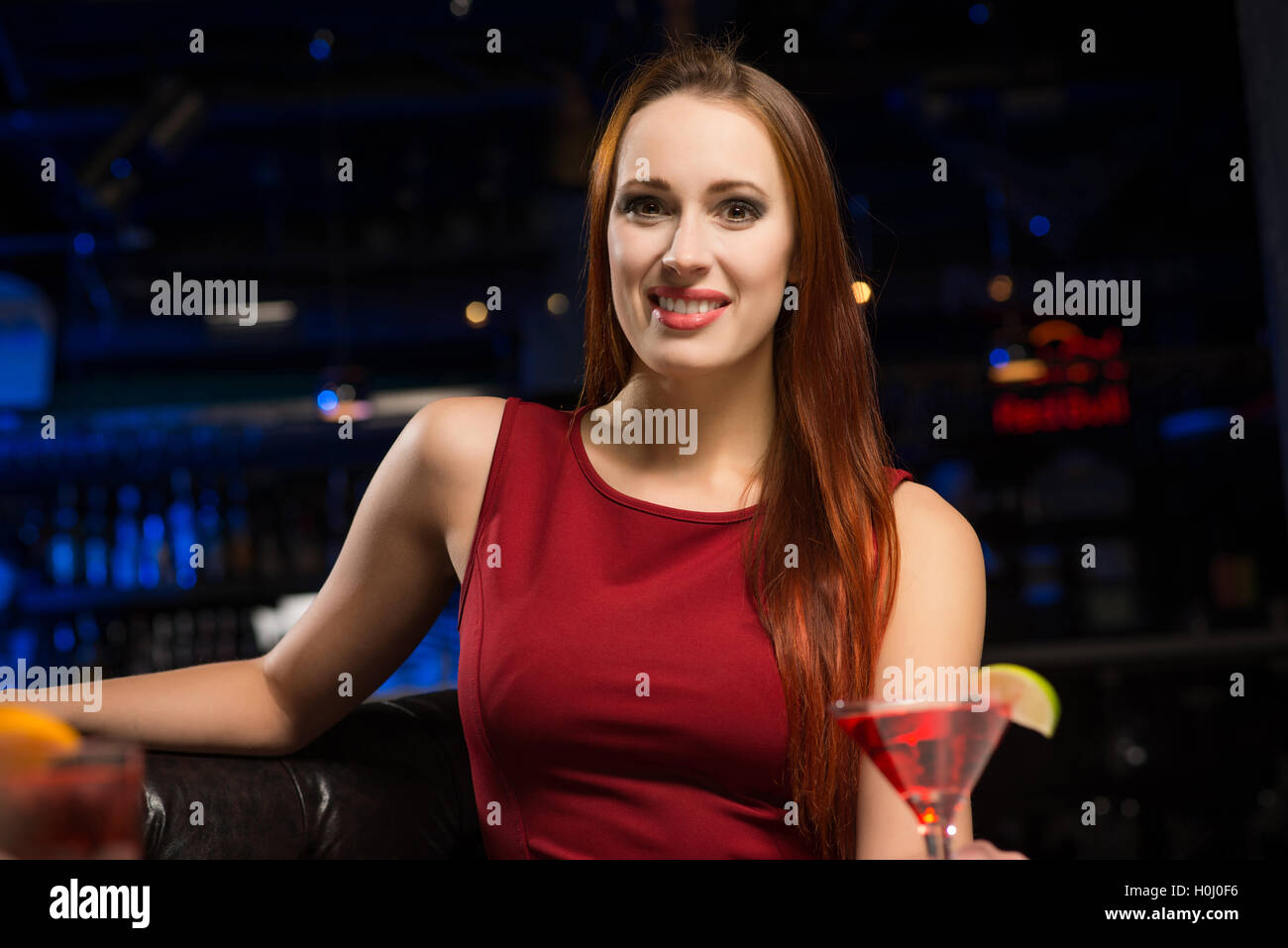 Portrait of an attractive woman in a nightclub Stock Photo - Alamy
