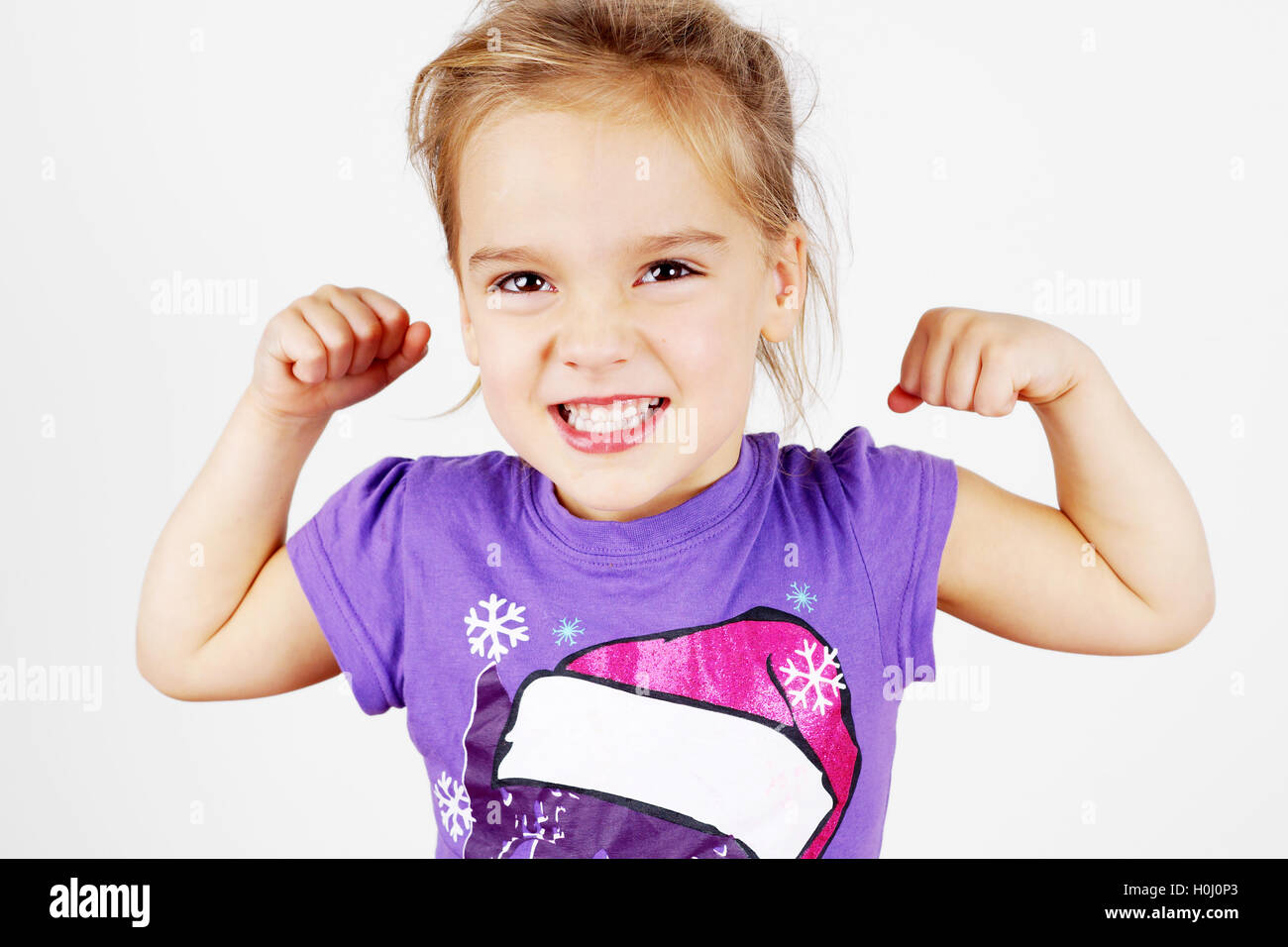 Blond little girl with muscle Stock Photo - Alamy
