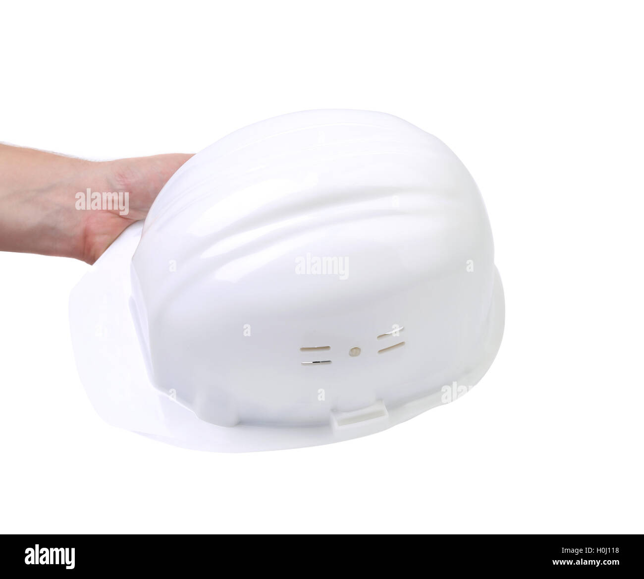 Hand holding white hard hat Stock Photo - Alamy