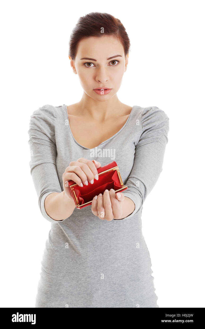 Beautiful casual woman showing her empty wallet Stock Photo - Alamy