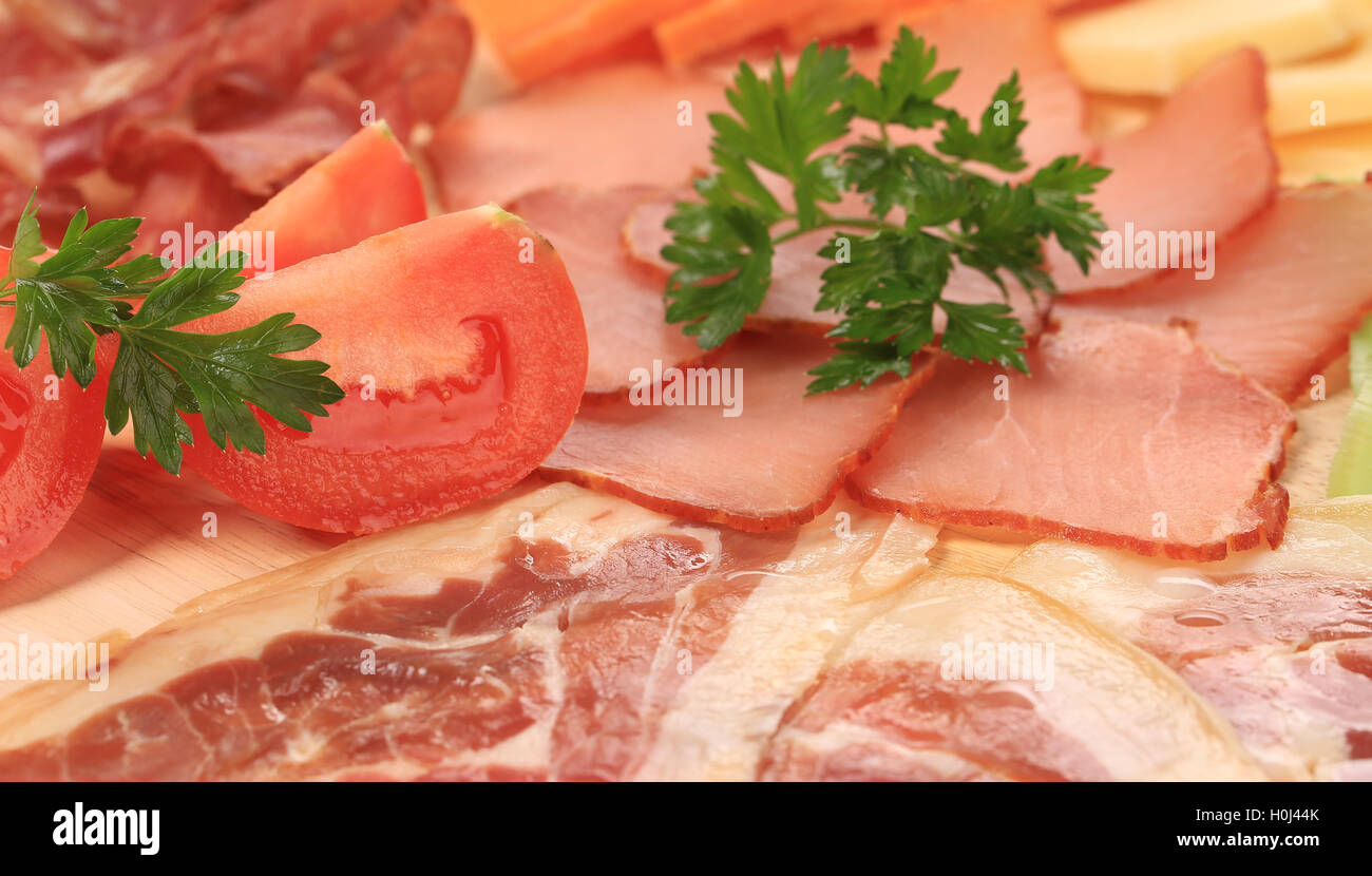Various meat slices and parsley Stock Photo - Alamy
