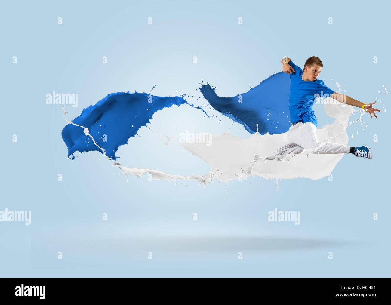 young male dancer jumping with splash of paint Stock Photo - Alamy