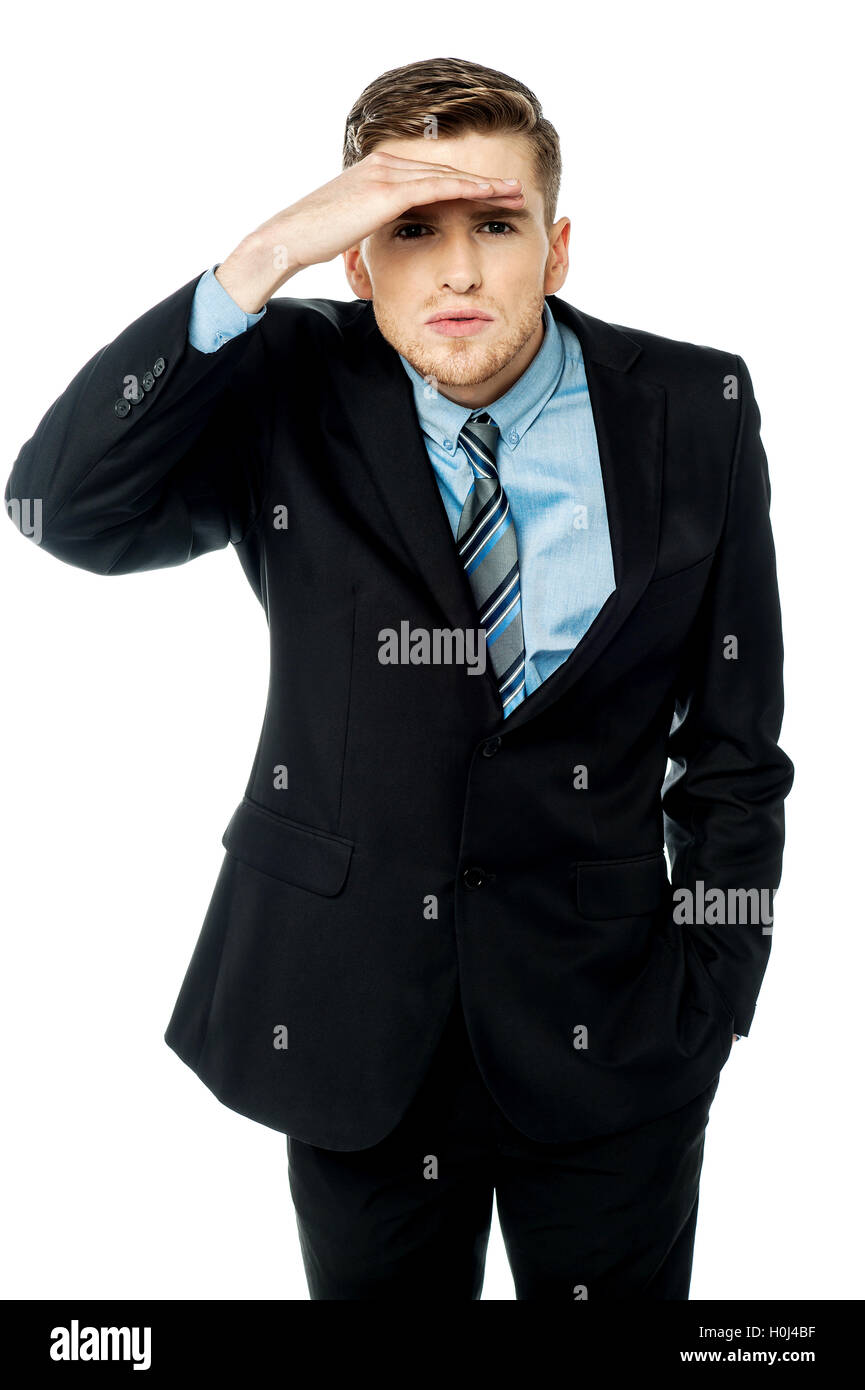 Corporate guy observing something closely Stock Photo - Alamy