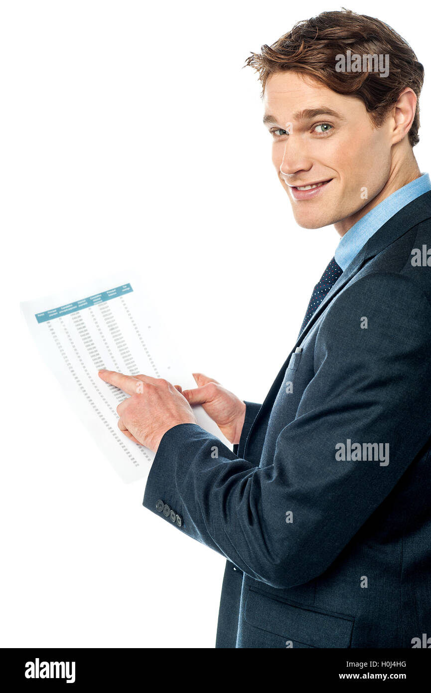 Businessman reviewing document standing hi-res stock photography and ...