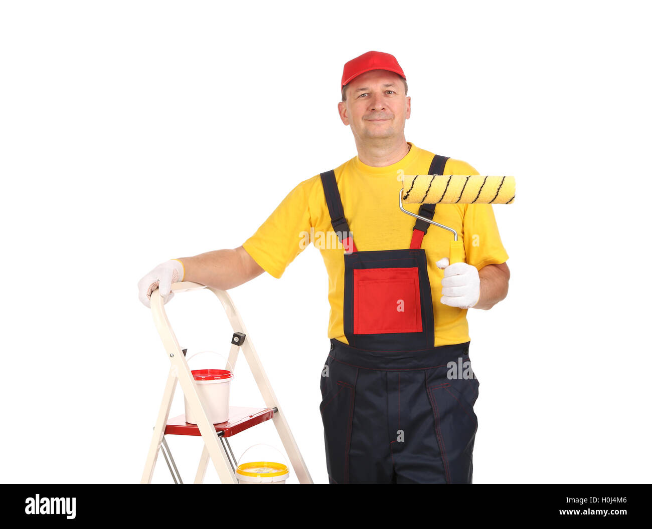 Worker on ladder with roller Stock Photo - Alamy
