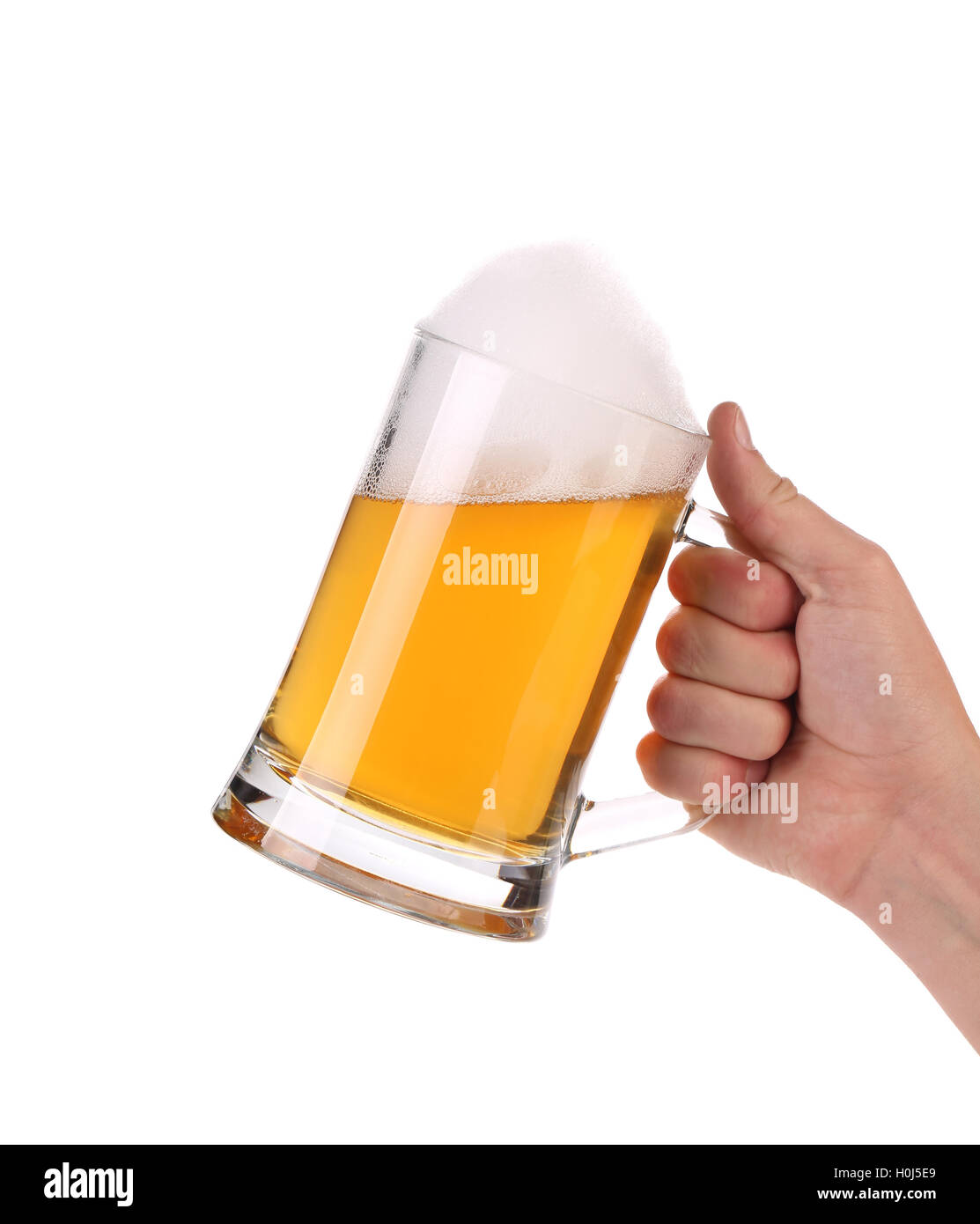 Hand holds mug of beer with foam Stock Photo - Alamy