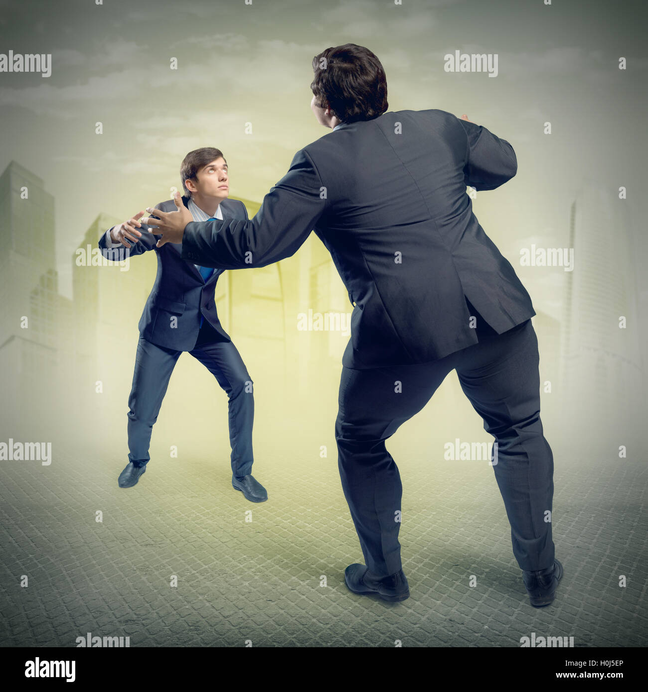 Two businessmen fighting hi-res stock photography and images - Alamy