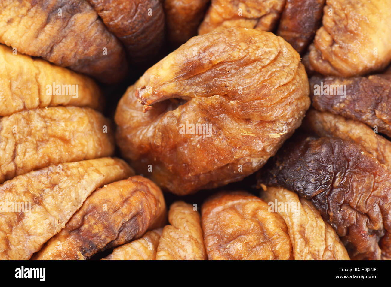 Heap dried fig background Stock Photo - Alamy